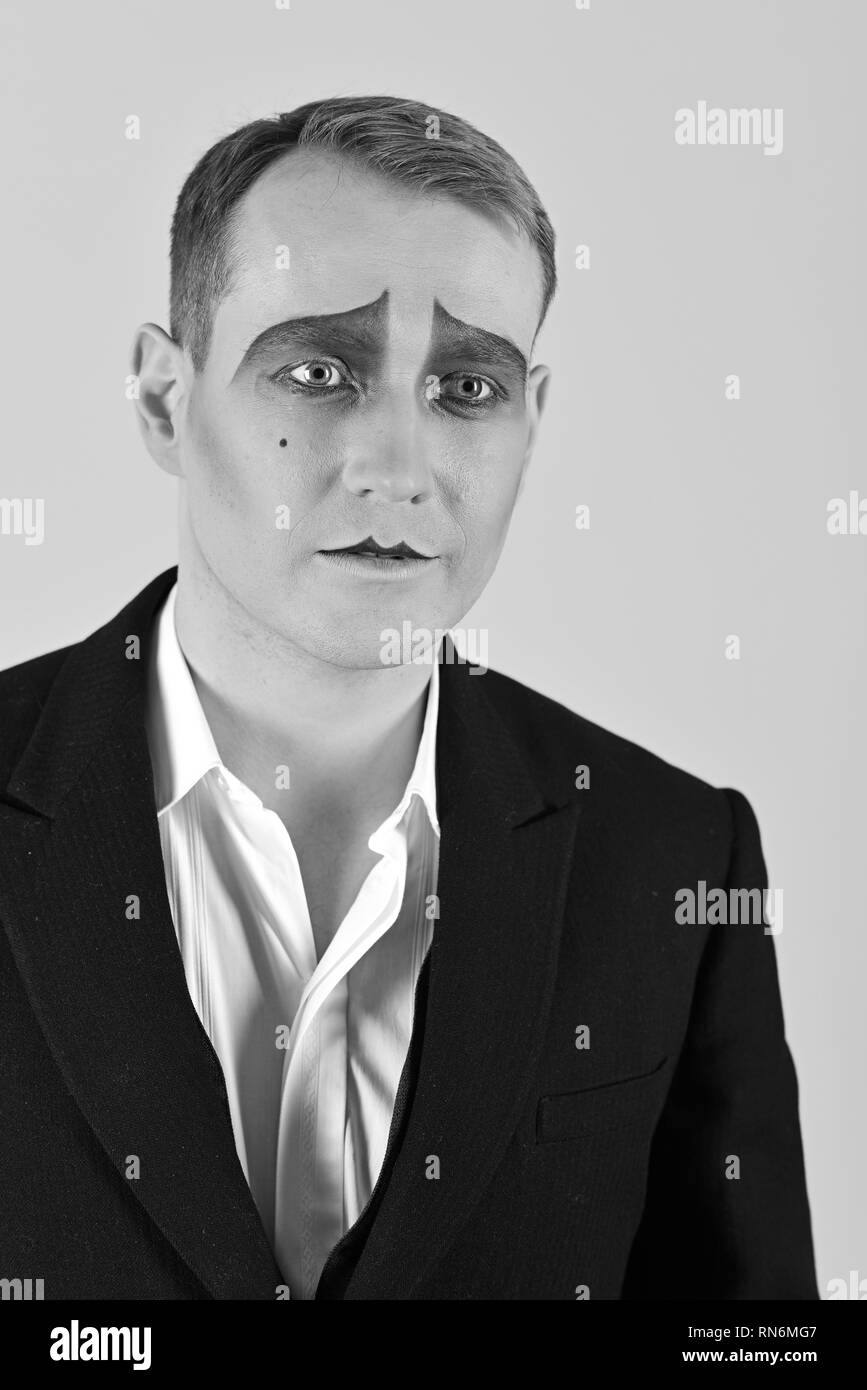 Dramatic and tragic. Unhappy mime with face paint. Theatre actor miming ...