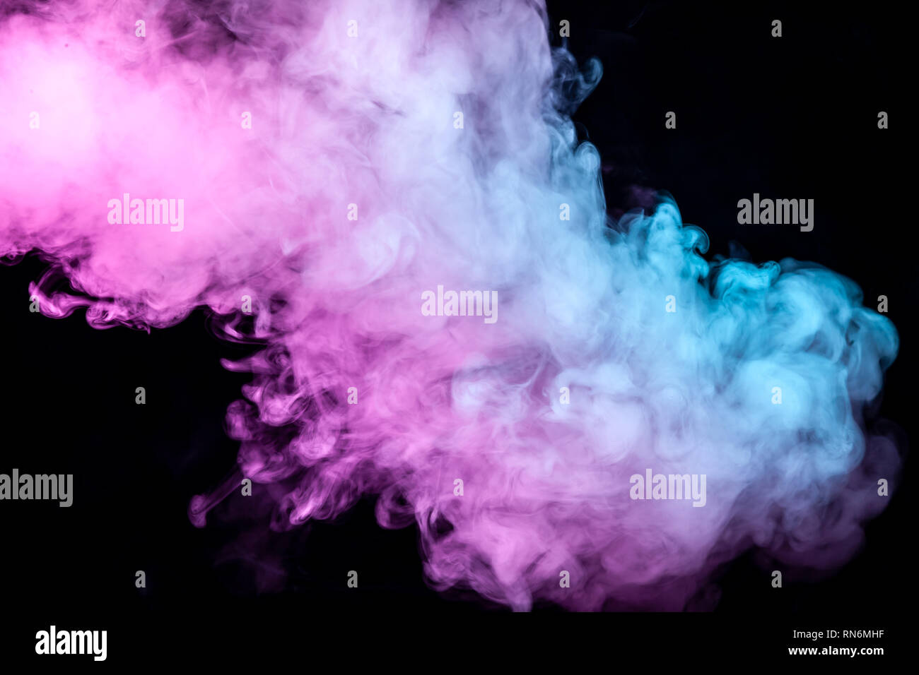 Translucent, thick smoke, illuminated by light against a dark ...