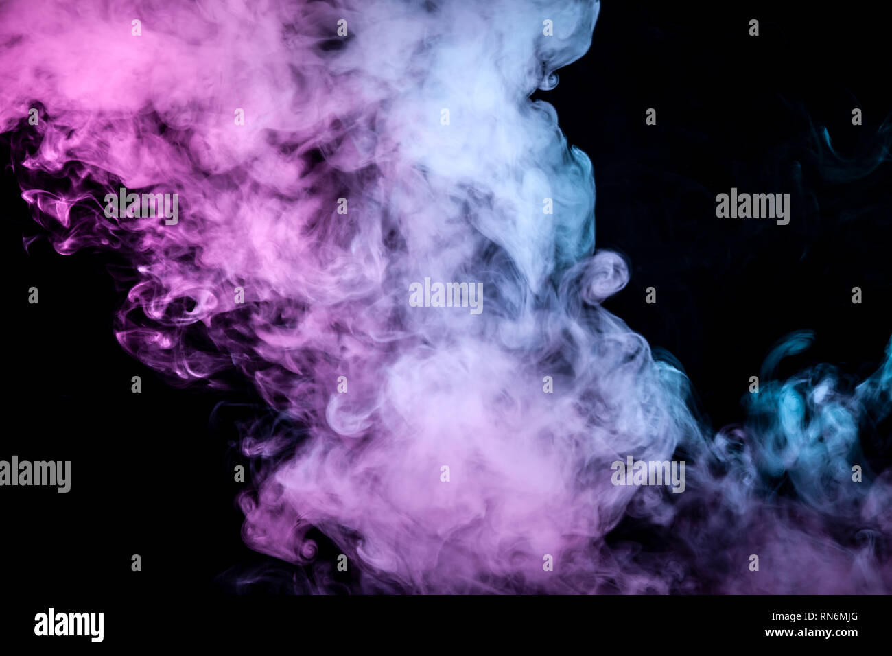 Translucent, thick smoke, illuminated by light against a dark ...