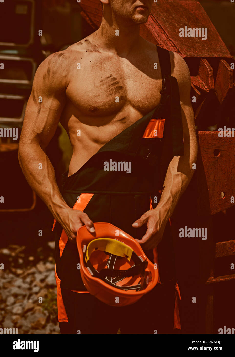 Muscle concept. Fit body in working uniform with biceps and triceps ...