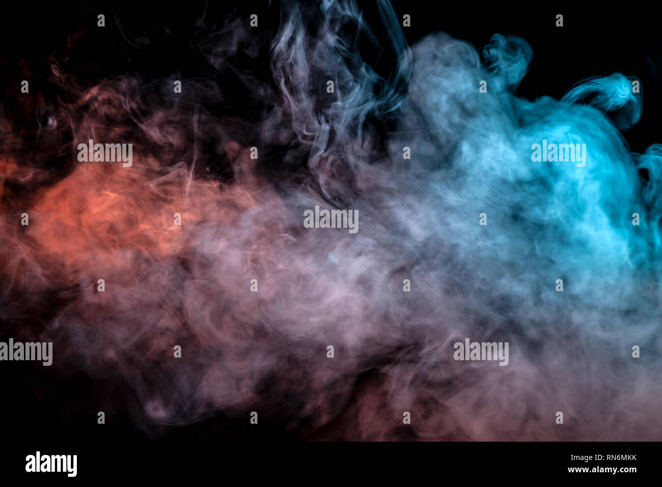 Translucent, thick smoke, illuminated by light against a dark ...