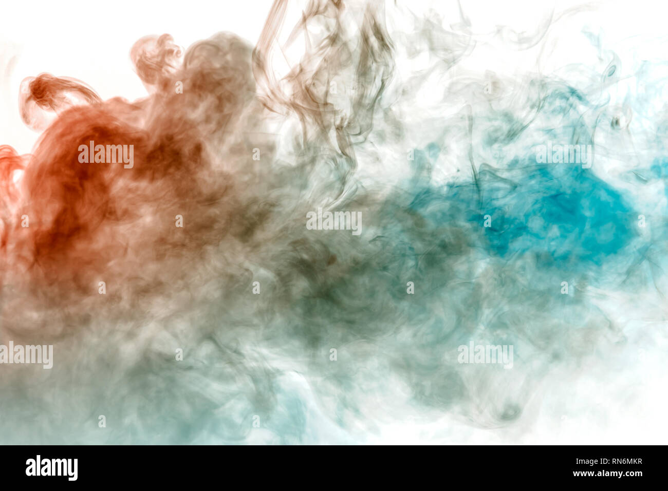 Blue-red smoke swirls on a white background depicting a beautiful ...