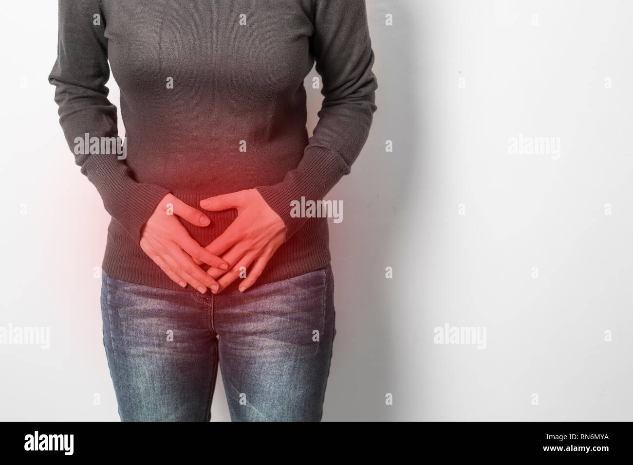 A woman has a pain in the bladder. Dysuria Stock Photo - Alamy