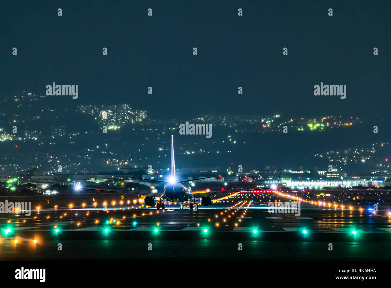 Jet plane taking off scene in the night Stock Photo - Alamy