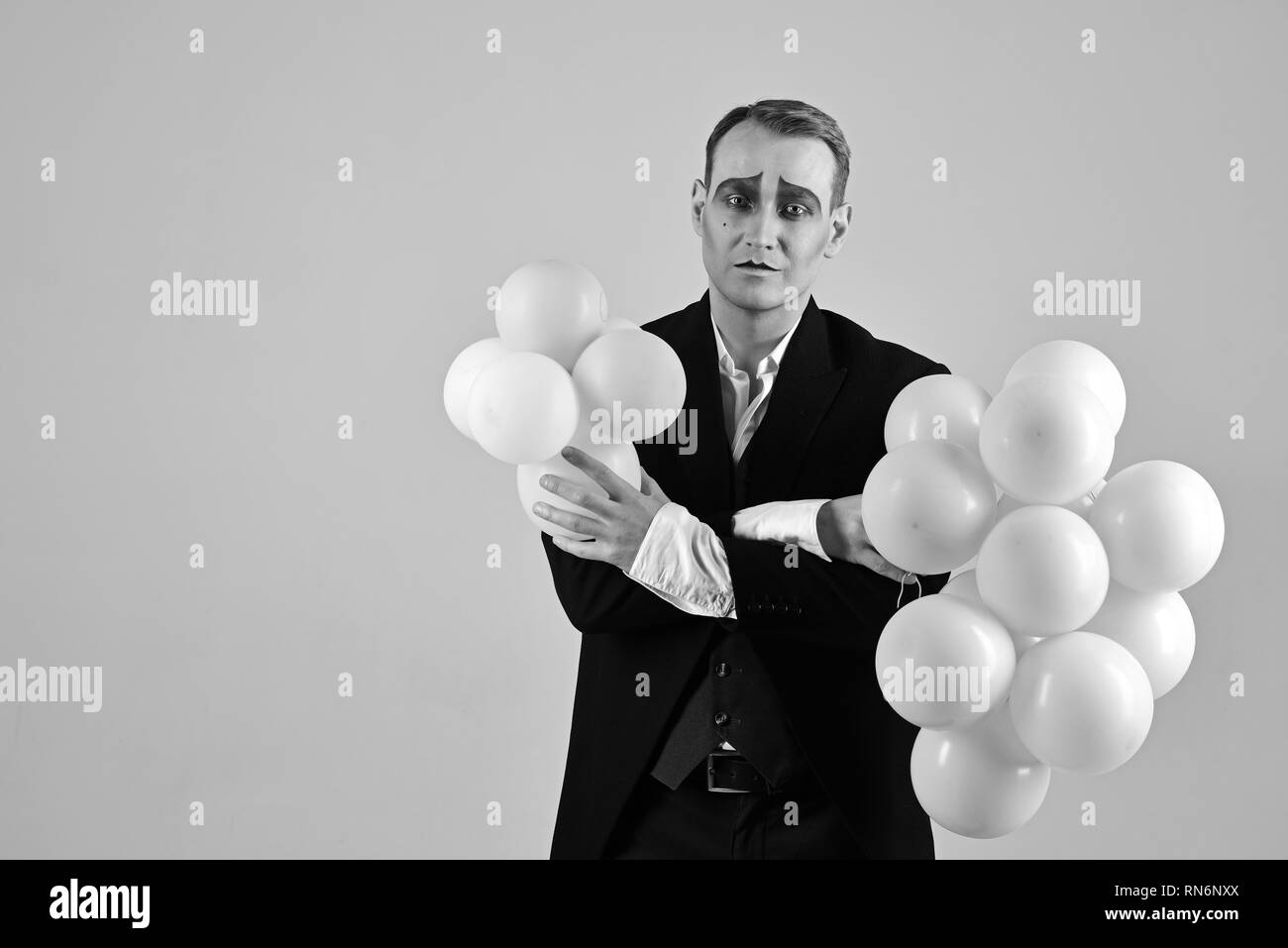 Special day to celebrate. Mime man with party balloons. Balloon artist ...