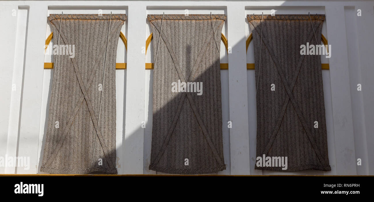 Old fashioned blinds against the sun and heat in Seville, Andalusia ...