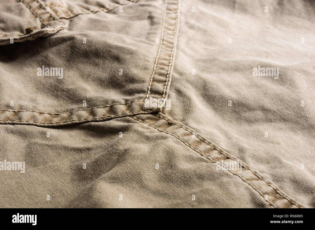 clothing items washed cotton fabric texture with seams, macro, close-up ...