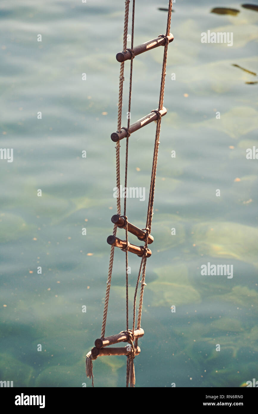 Achieving success. Rope ladder. Jacobs ladder. Rope ladder with wooden ...