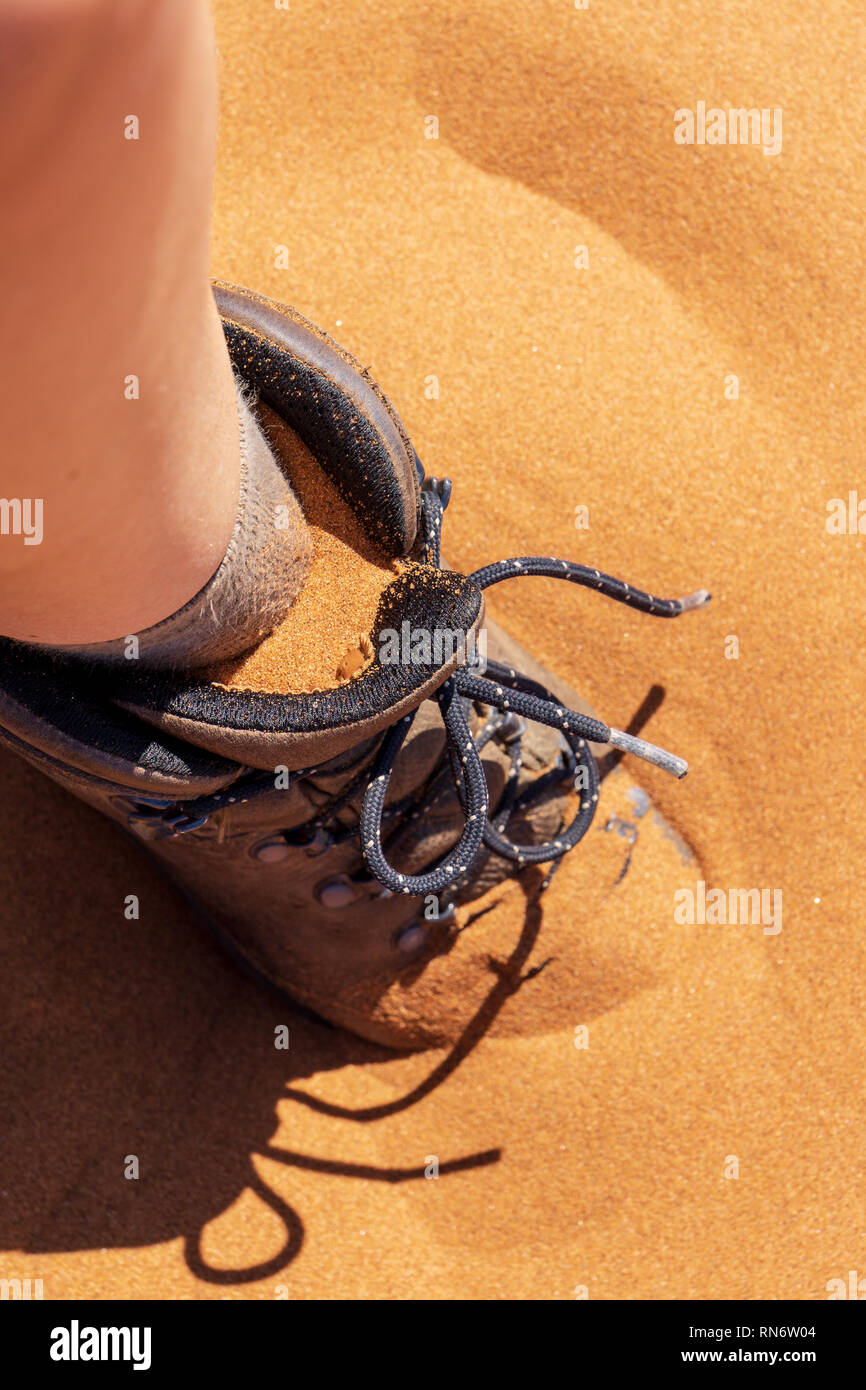 hiking boots in and full of sand at namibia desert Stock Photo - Alamy