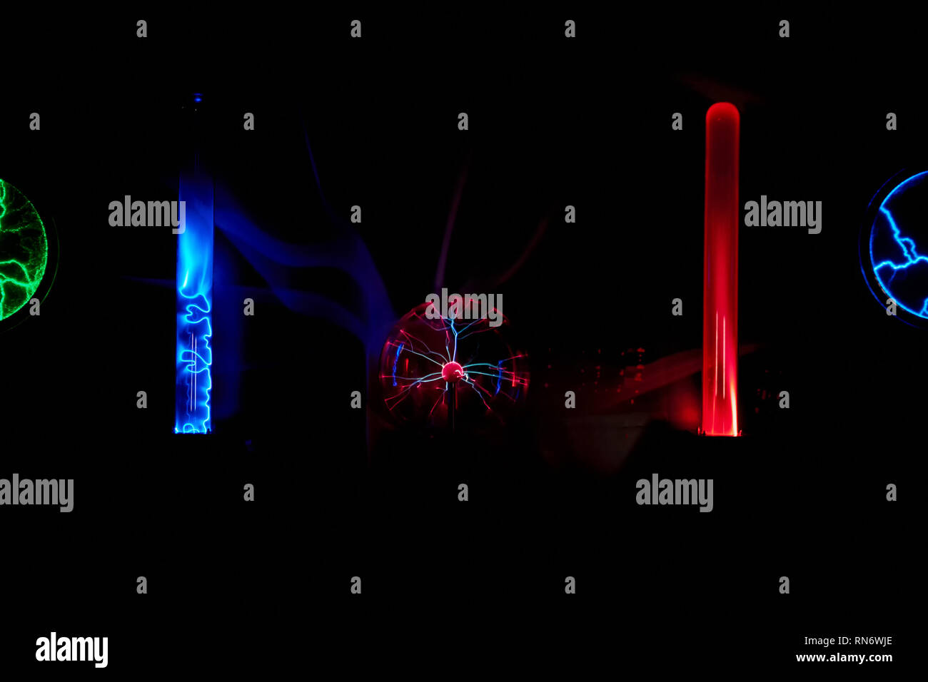 Electric plasma balls on dark background. Static electricity model ...