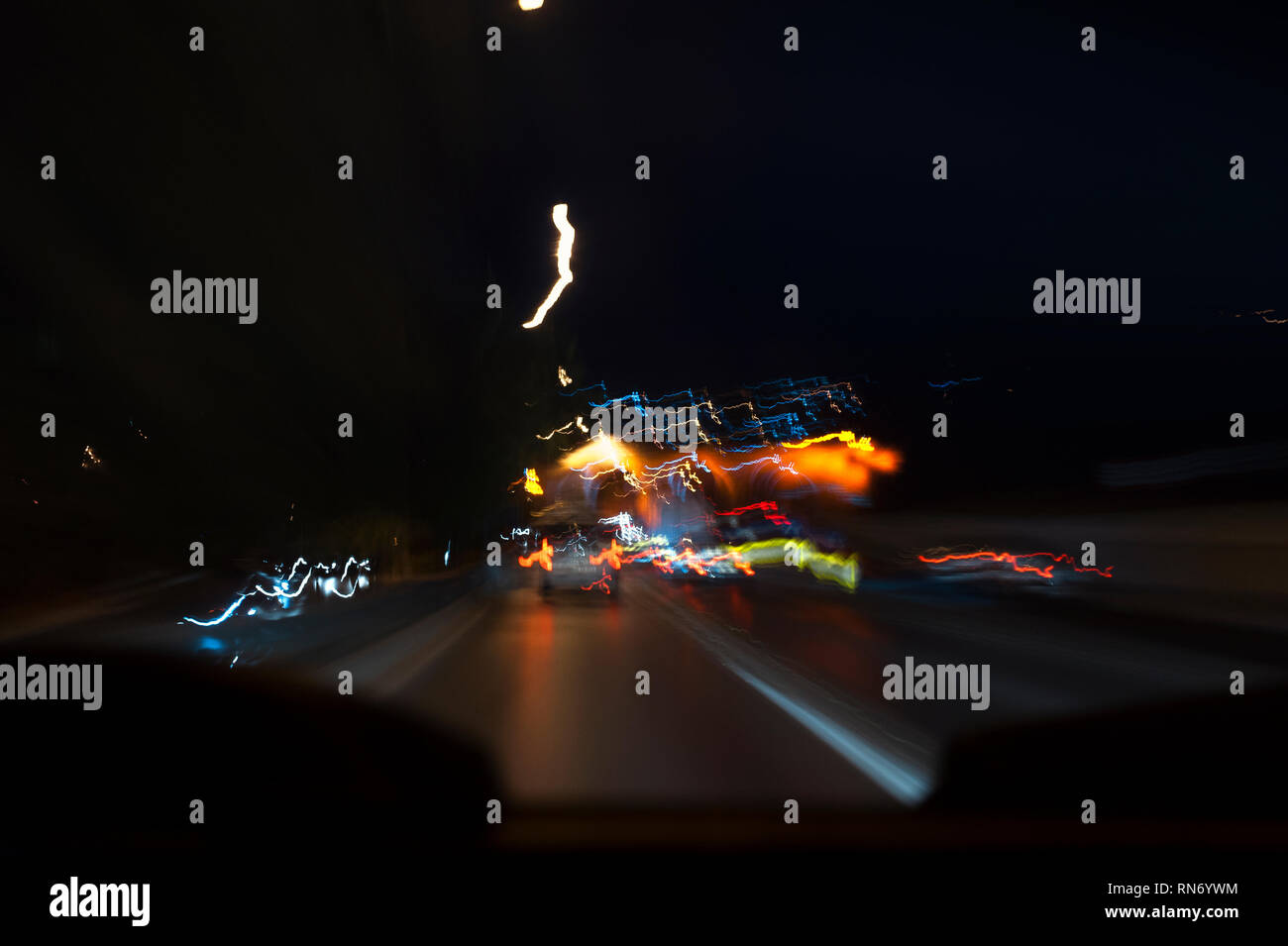 Looks like a view from eyes of a drunken driver, long exposure road ...