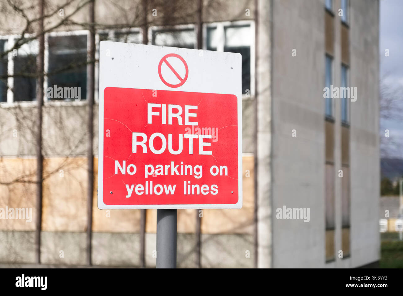 Fire assembly point route sign at office workplace Stock Photo - Alamy