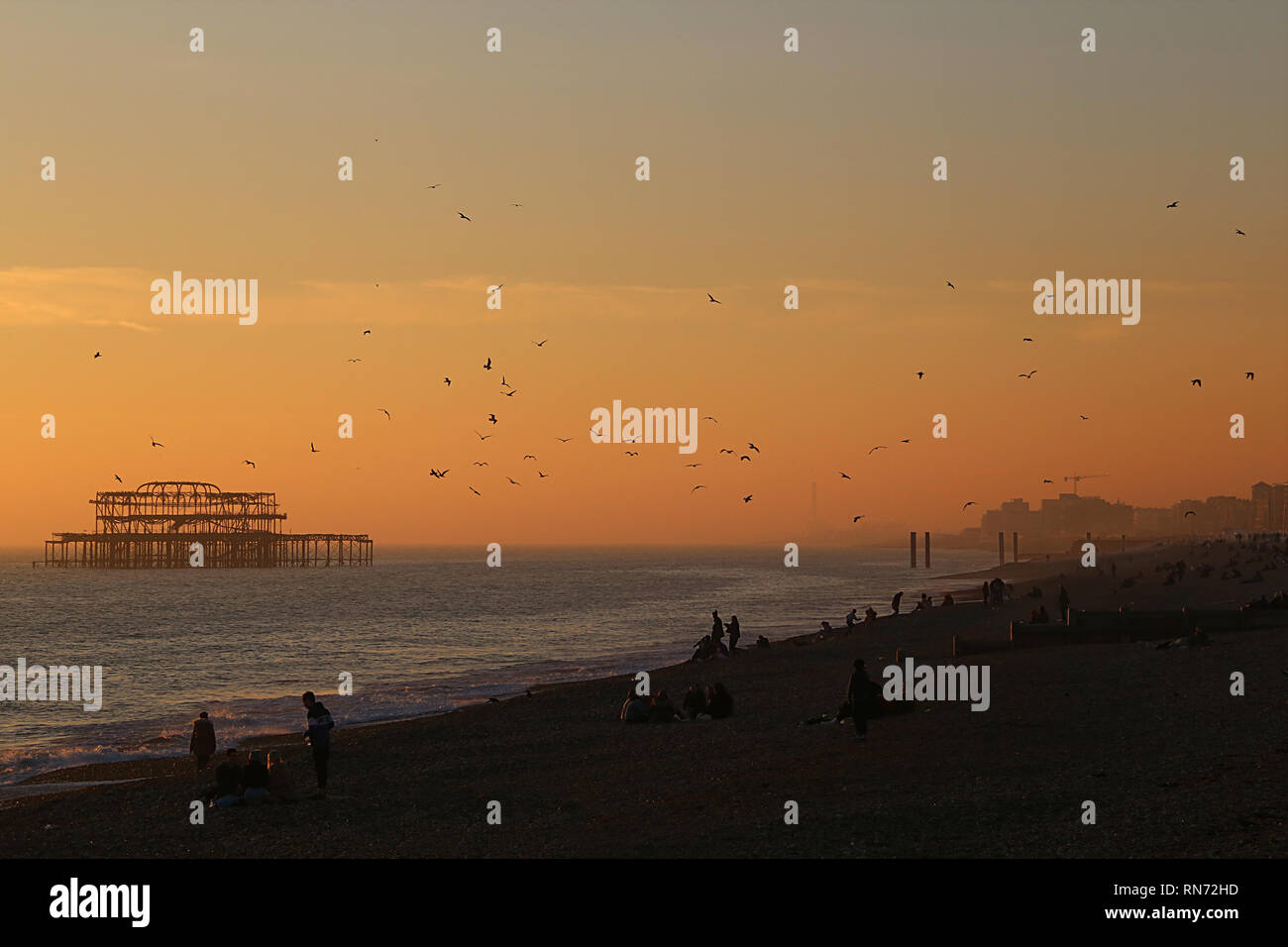 Brighton, United Kingdom. Sunset watching Stock Photo - Alamy
