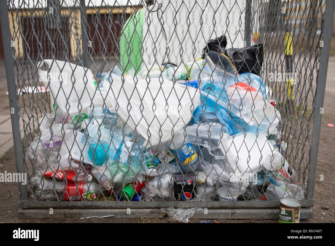 Plastic waste container. Garbage, mess, rubbish, bottles on the ground ...