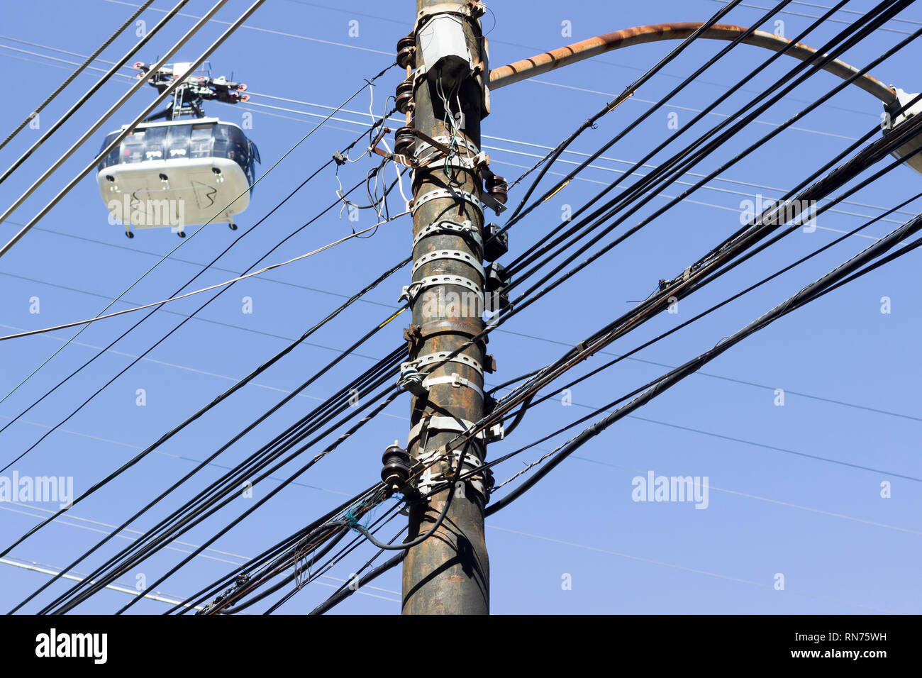 Graphic lines of power cables merged with Sugarloaf's tram with a blue ...