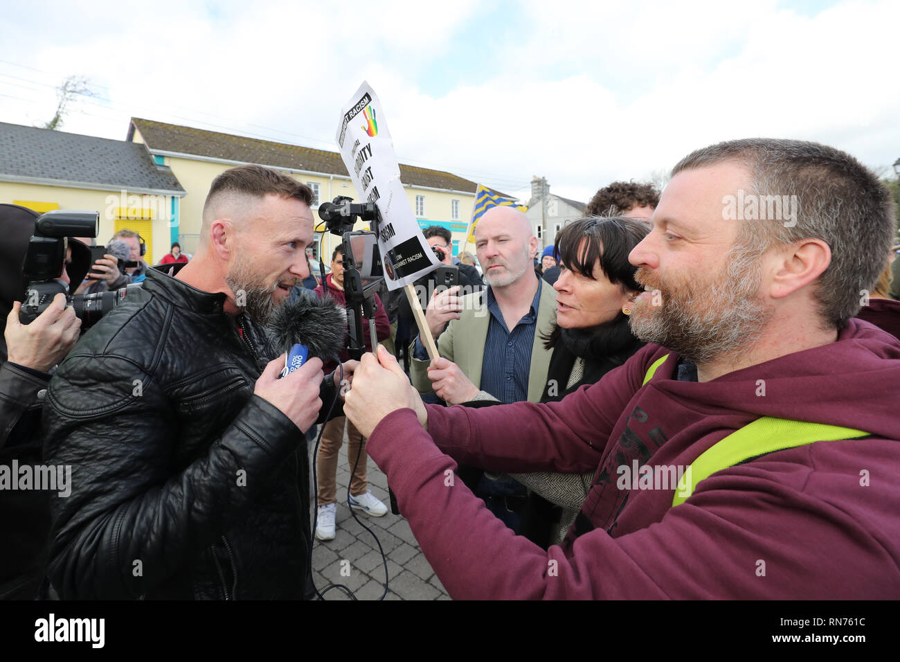 Pro and anti-refugee protesters confront each other at an an anti ...