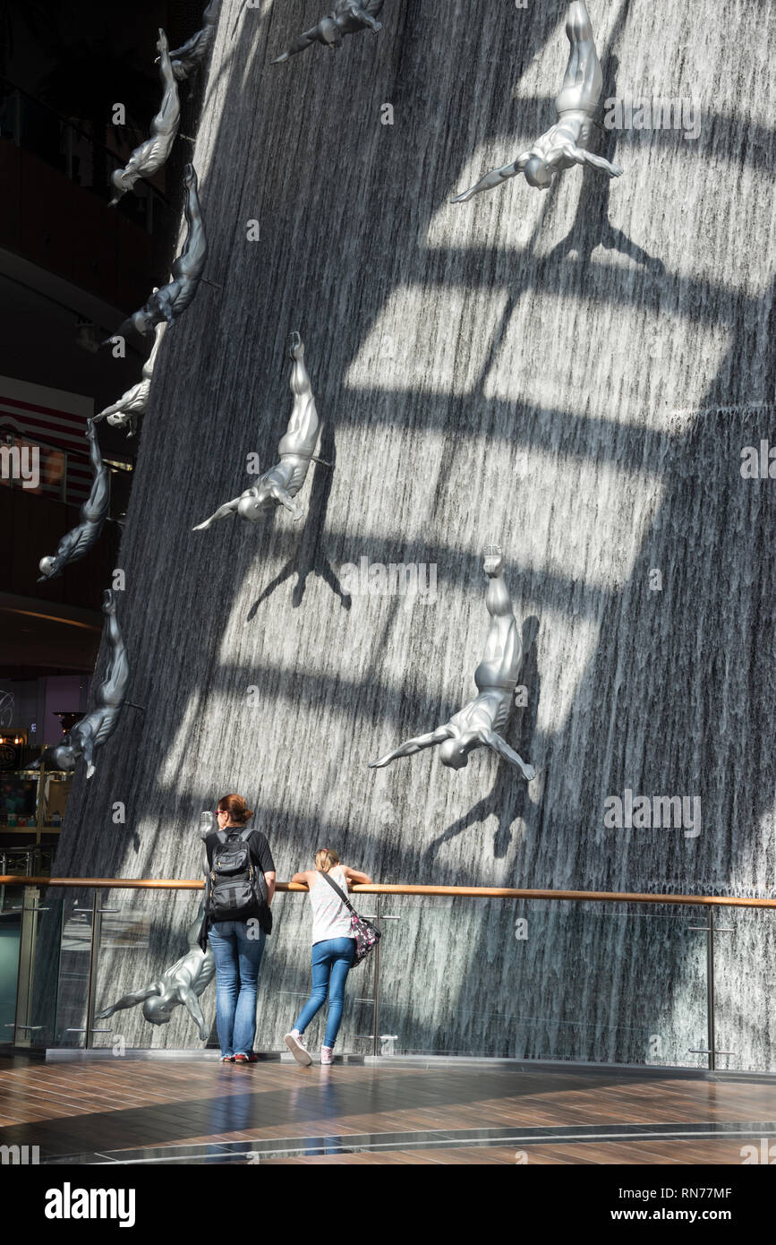 The Waterfall runs through the entire height of The Dubai Mall ...