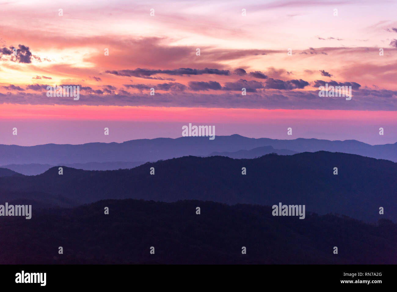 Stacked into layers of mountains Stock Photo - Alamy