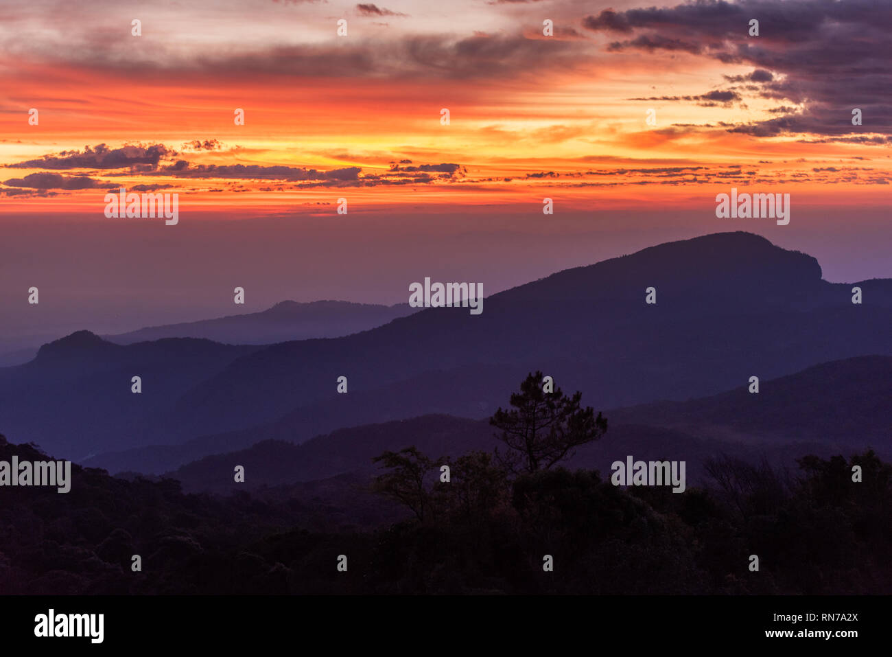 Stacked into layers of mountains Stock Photo - Alamy