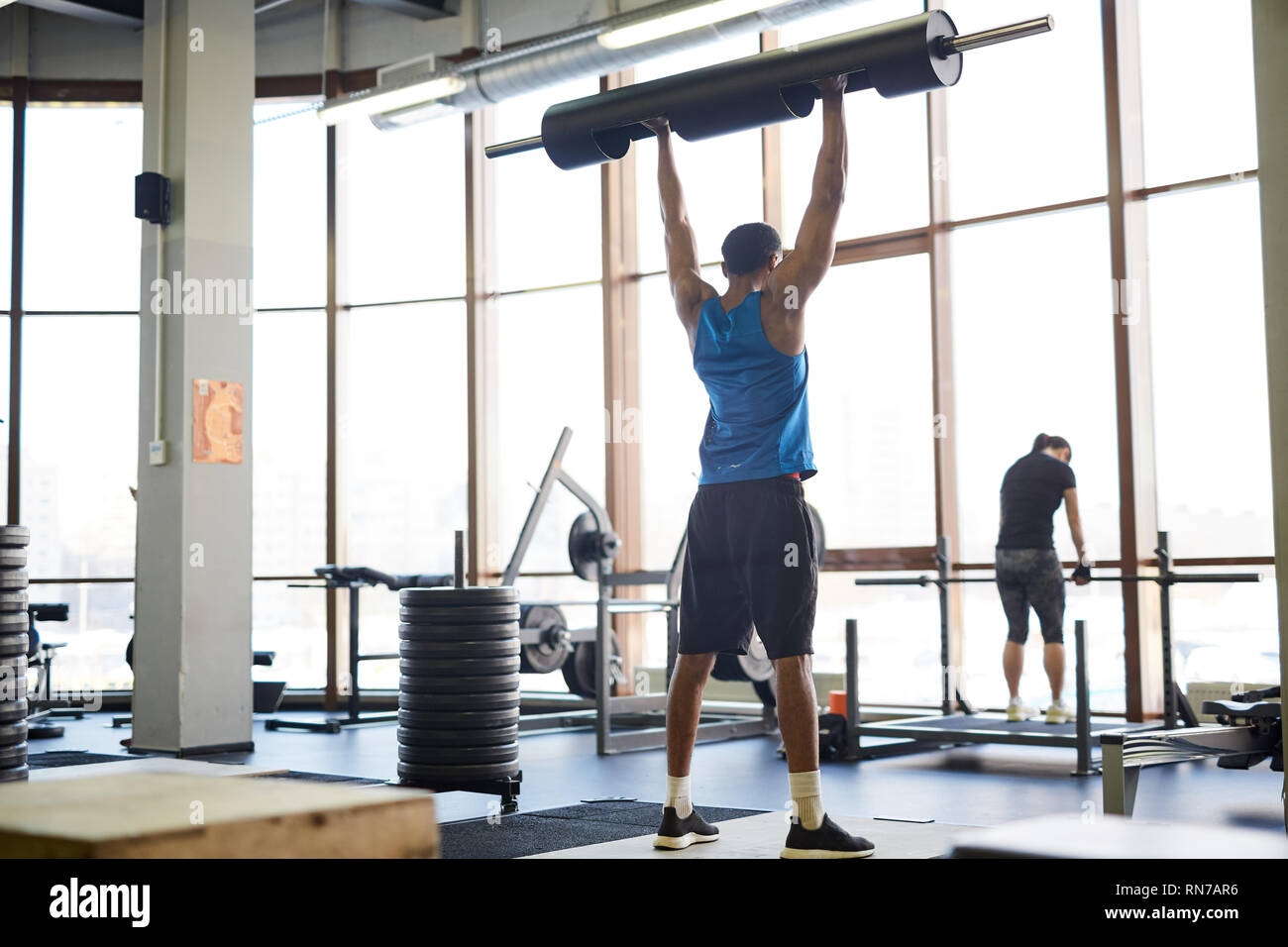 Young man lifting gear hi-res stock photography and images - Alamy