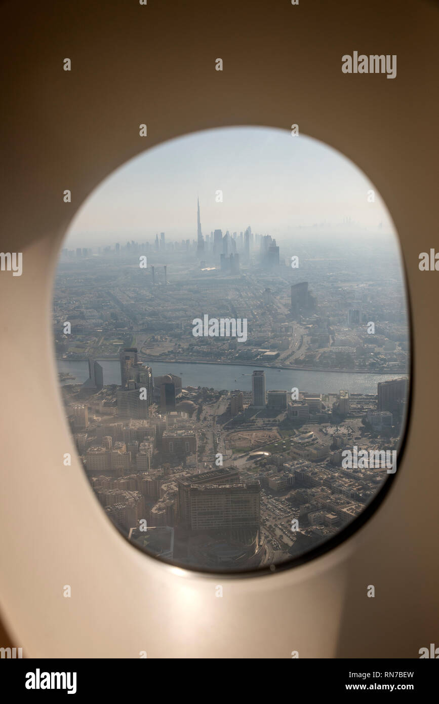 An aircraft window view of a late afternoon of a thick heat haze over ...