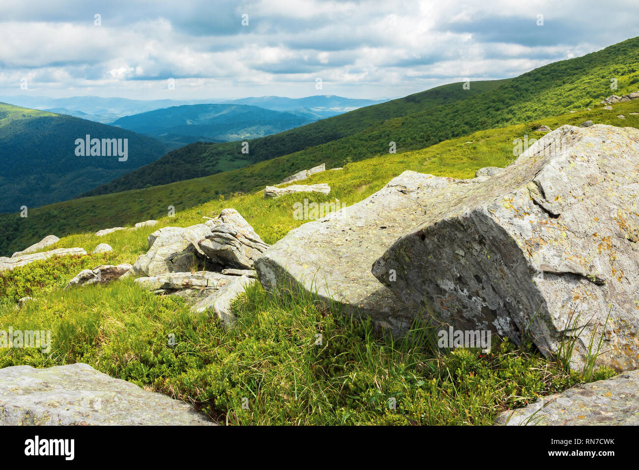 massive rocks on a grassy meadow. beautiful summer landscape in ...