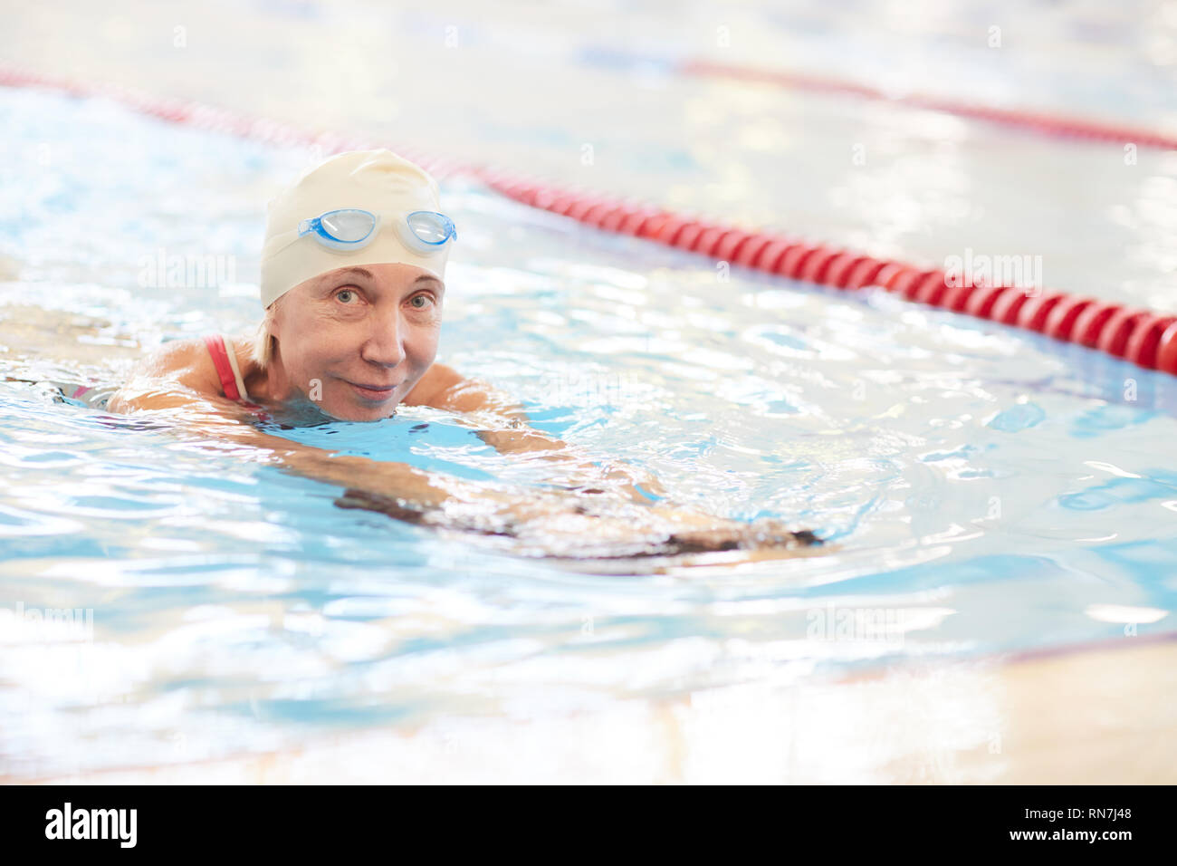 Senior woman swimming hi-res stock photography and images - Alamy