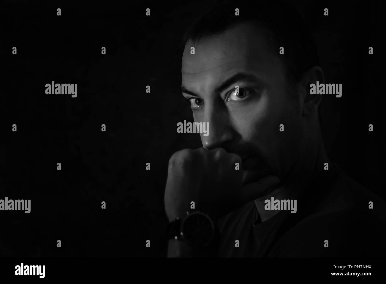 Portrait of a man, black background Stock Photo - Alamy