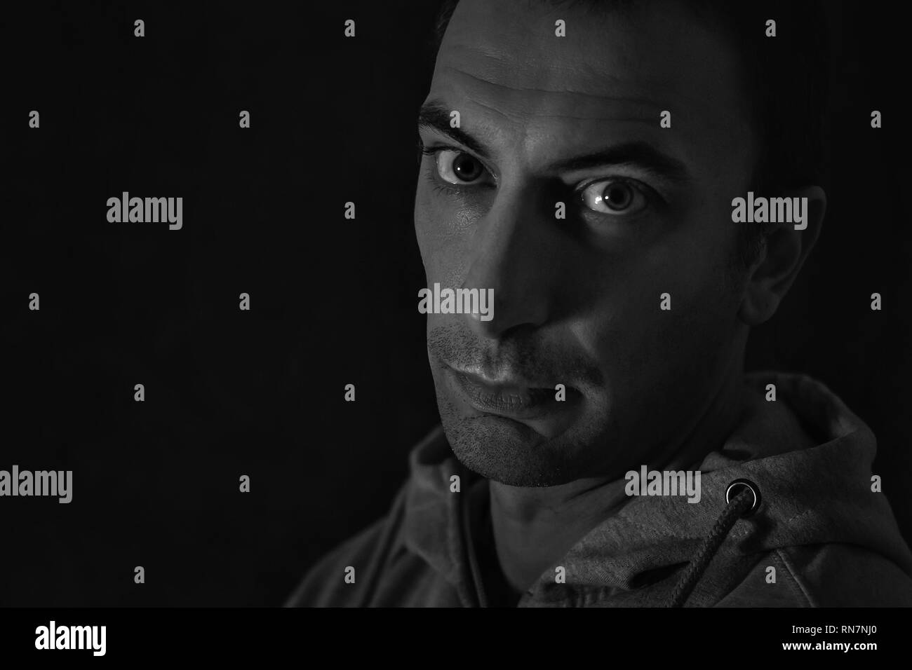 Portrait of a man, black background Stock Photo - Alamy