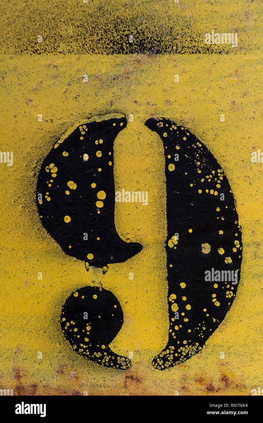 cracked black number template painted on yellow backdrop, number 9 ...