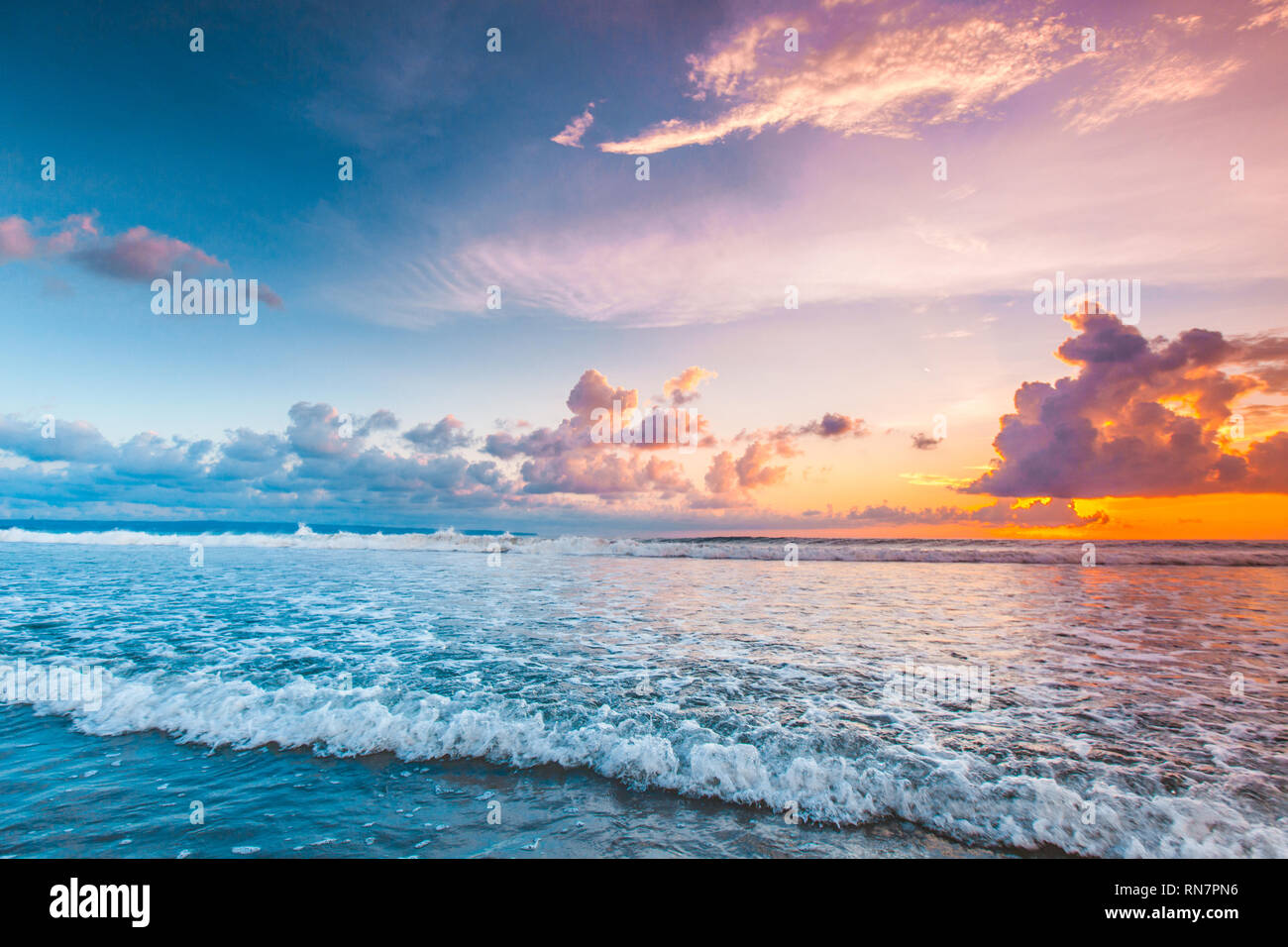 Amazing colorful sunset over sea form Bali beach Stock Photo - Alamy