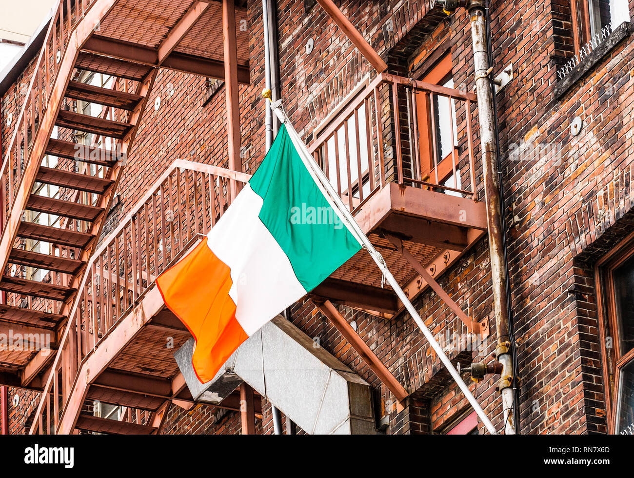 Irish Flag on Old Red Brick Buildings Stock Photo - Alamy