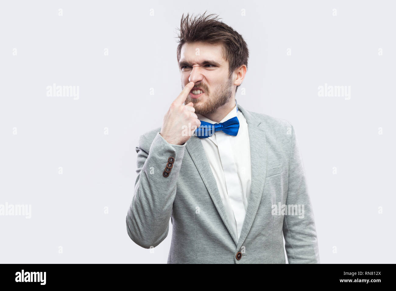 Your are liar. Portrait of angry handsome bearded man in casual grey ...