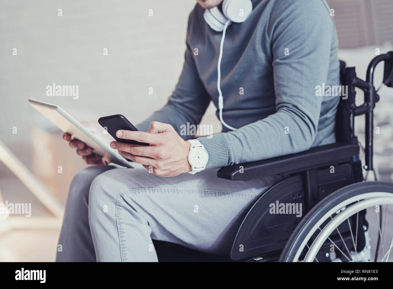 Digital device. Close up of a modern smartphone being in hands of a ...