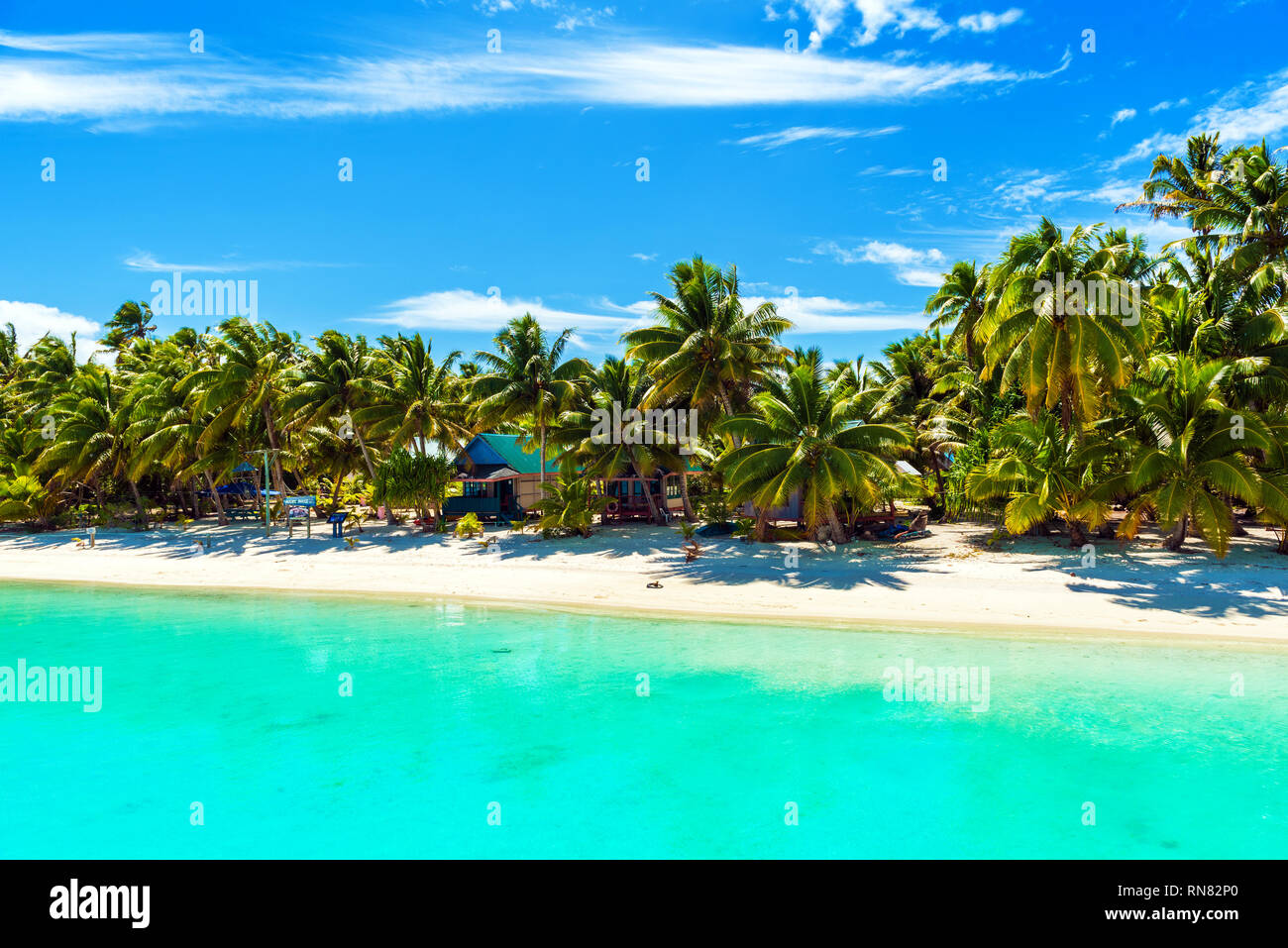 Stunning tropical Aitutaki island with palm trees, white sand ...