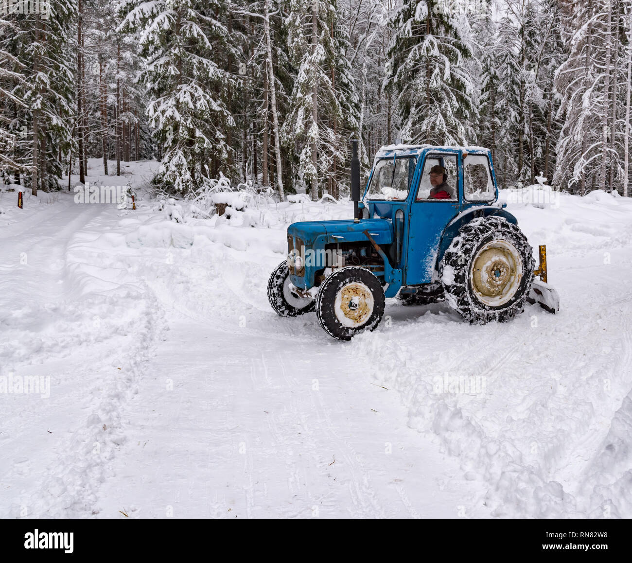 old blue fordson dexta tractor plowing snow in sweden 2019 Stock Photo ...