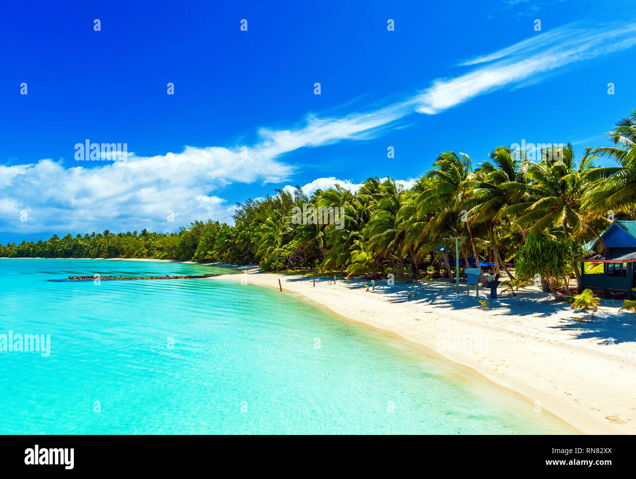 Stunning tropical Aitutaki island with palm trees, white sand ...