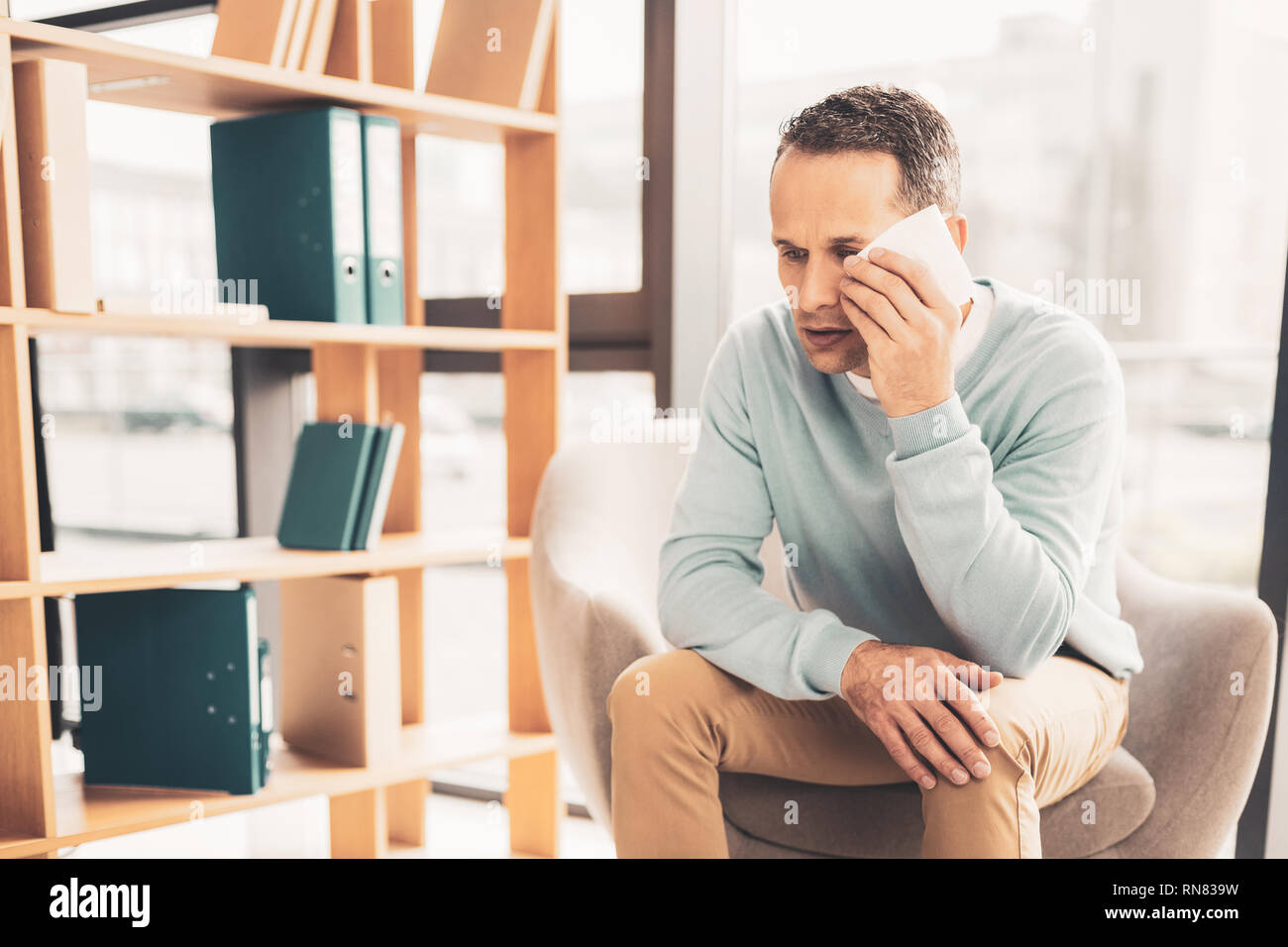 Strong headache. Sick bothered man feeling very terrible suffering from ...