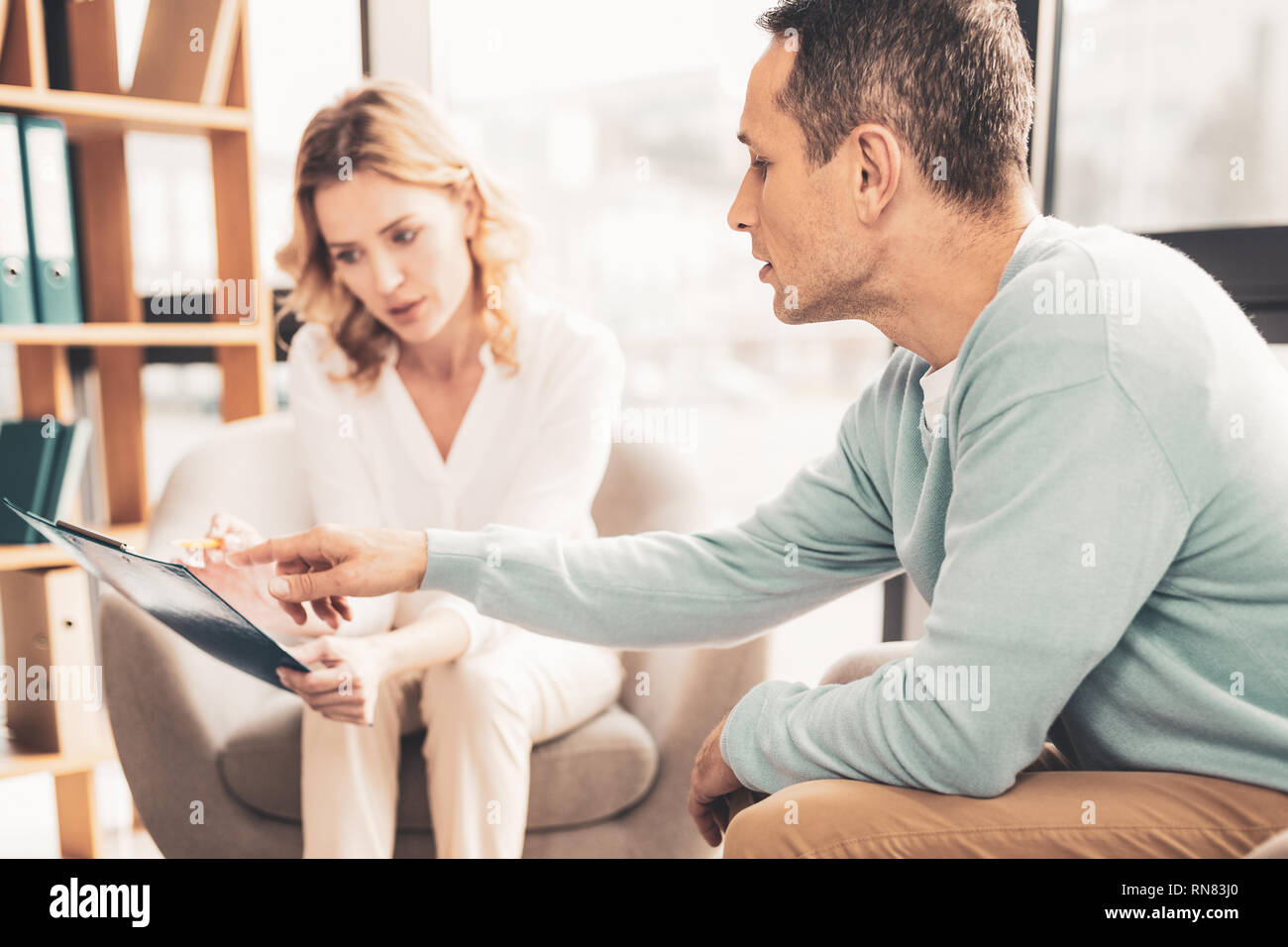 Giving instructions. Successful industrious business man feeling busy ...