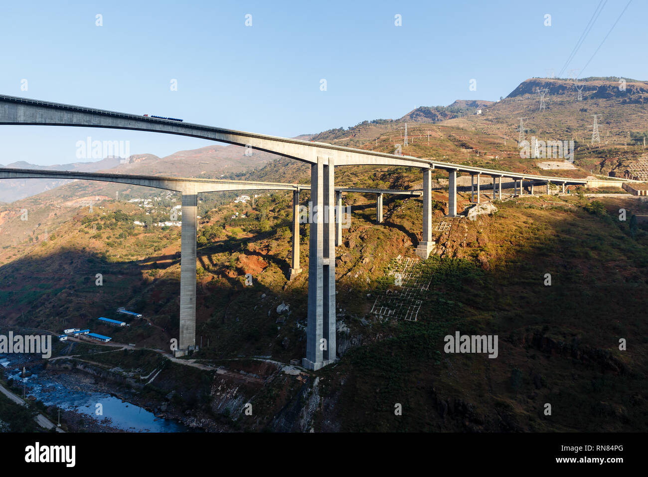 highway overpass bridge in the mountains at sunrise, China Stock Photo ...