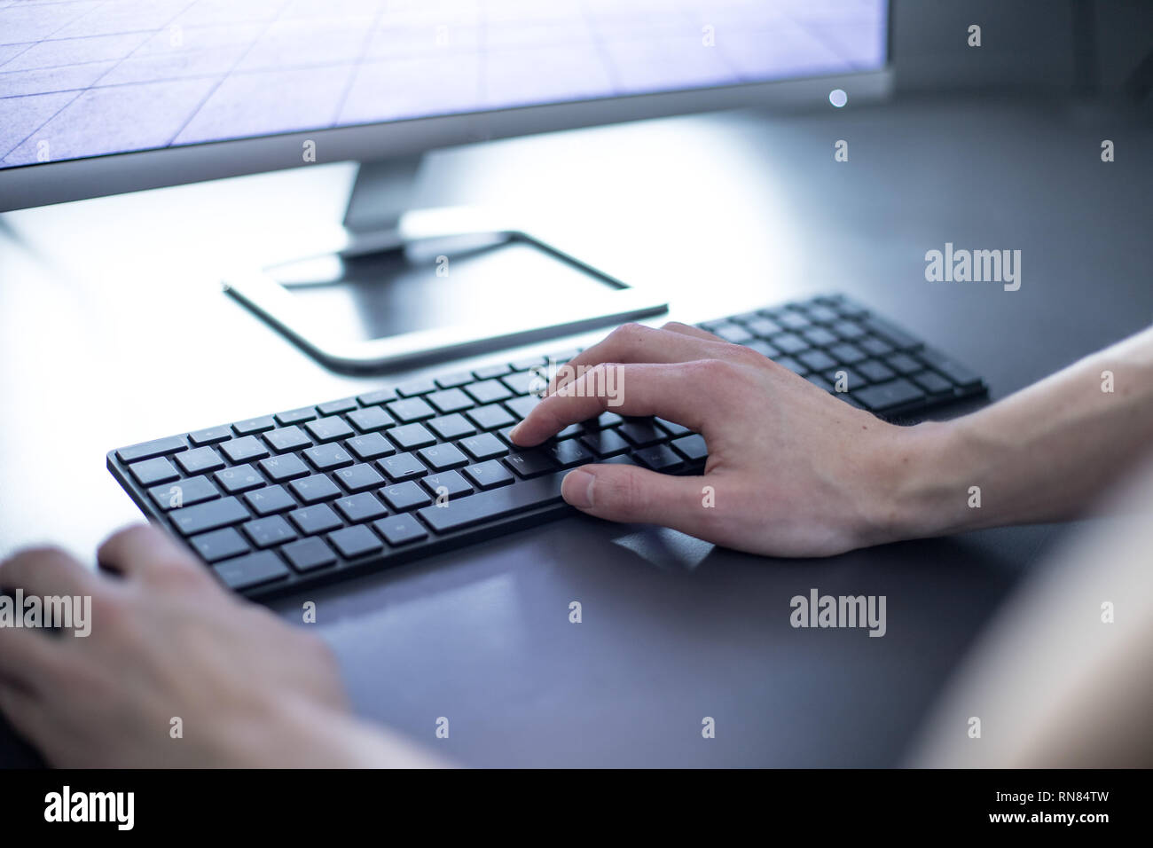 Workplace of a freelancer: Arrangement of computer, keyboard and typing ...
