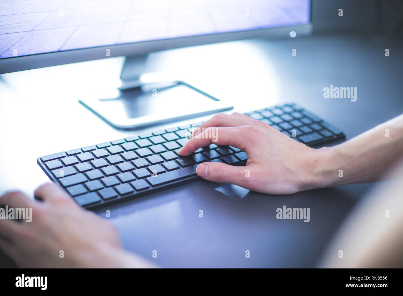 Workplace of a freelancer: Arrangement of computer, keyboard and typing ...