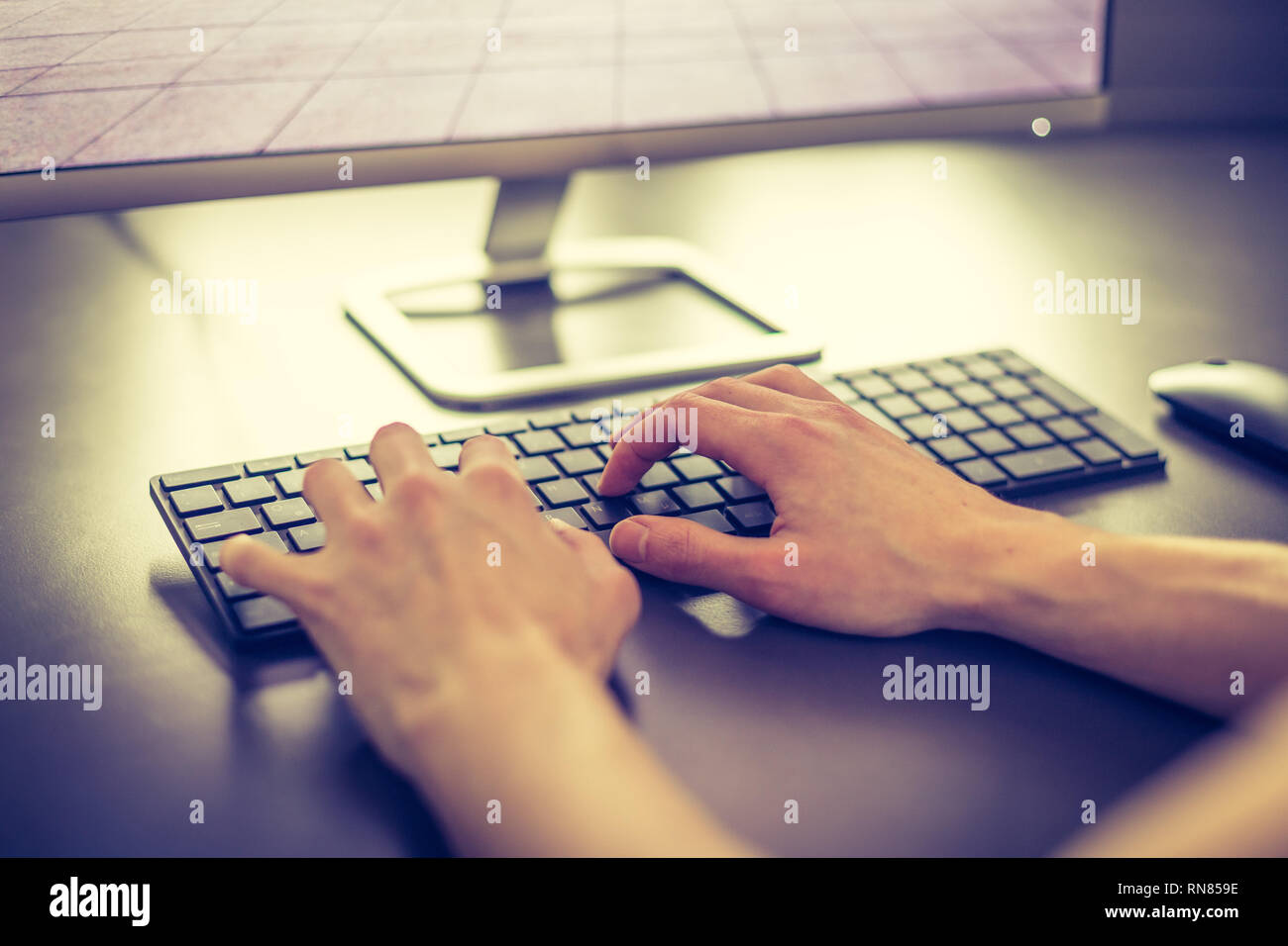 Workplace of a freelancer: Arrangement of computer, keyboard and typing ...
