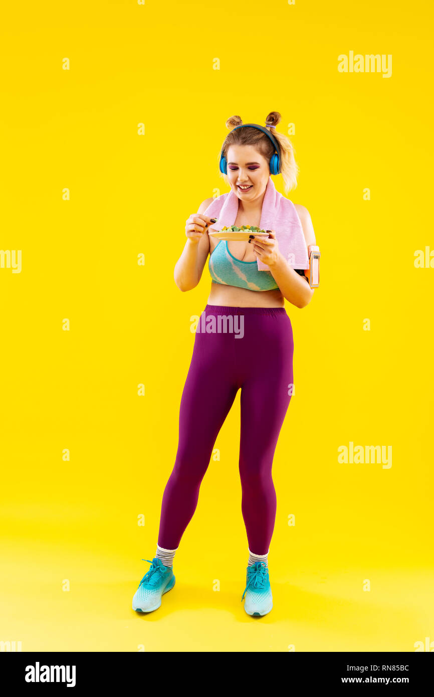 Woman wearing sport clothes feeling excited before eating snack Stock ...