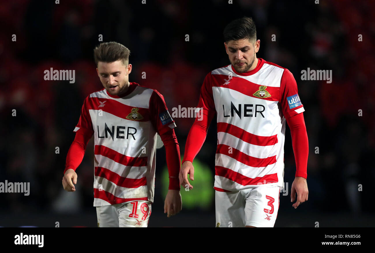 Doncaster Rovers' Alfie May (left) and Danny Andrew appear dejected ...