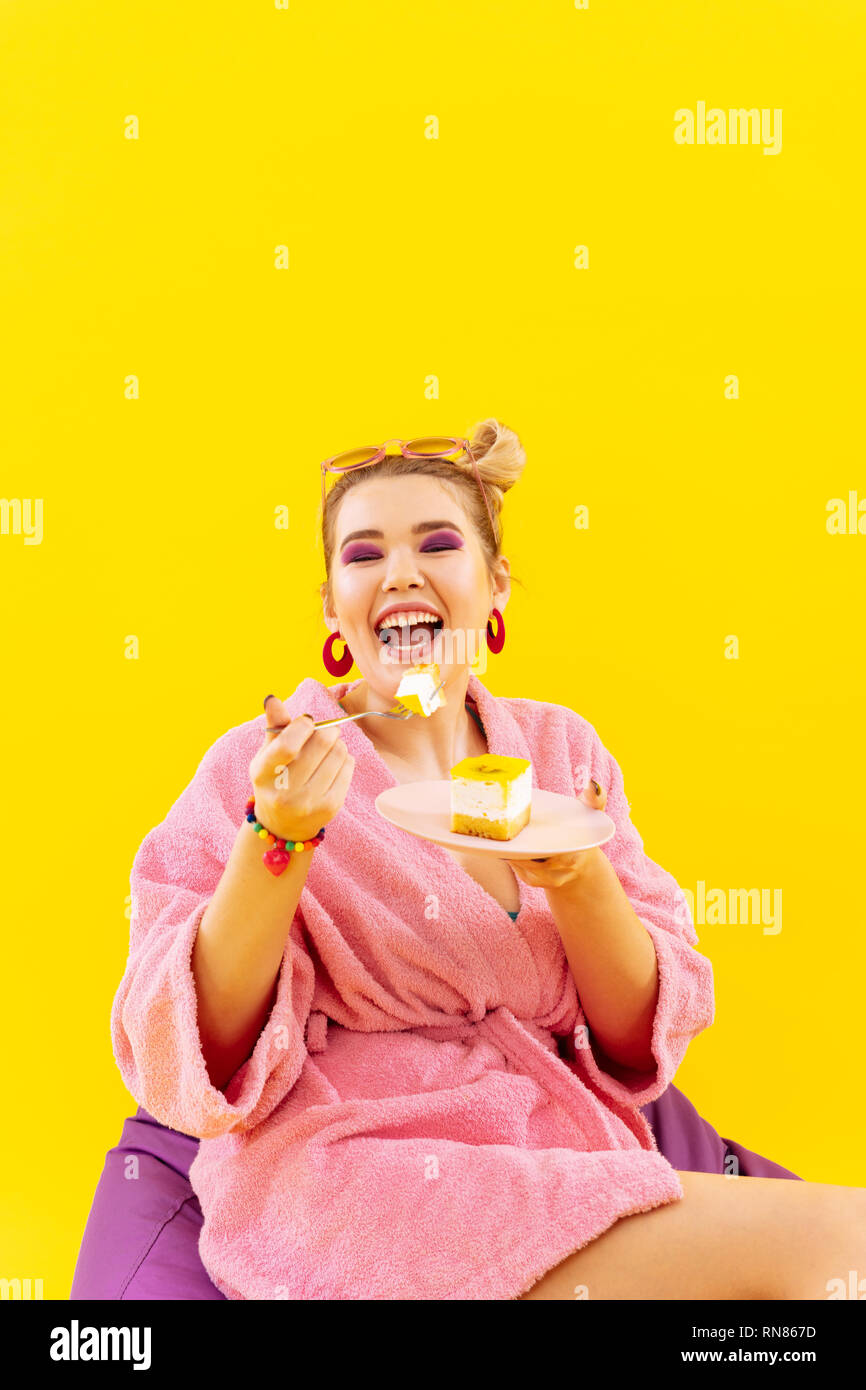 Woman having some overweight eating sweet fruit cake Stock Photo - Alamy