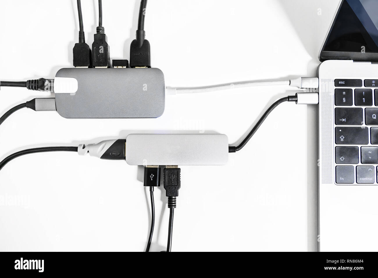 Laptop with adapters, disorder Stock Photo - Alamy