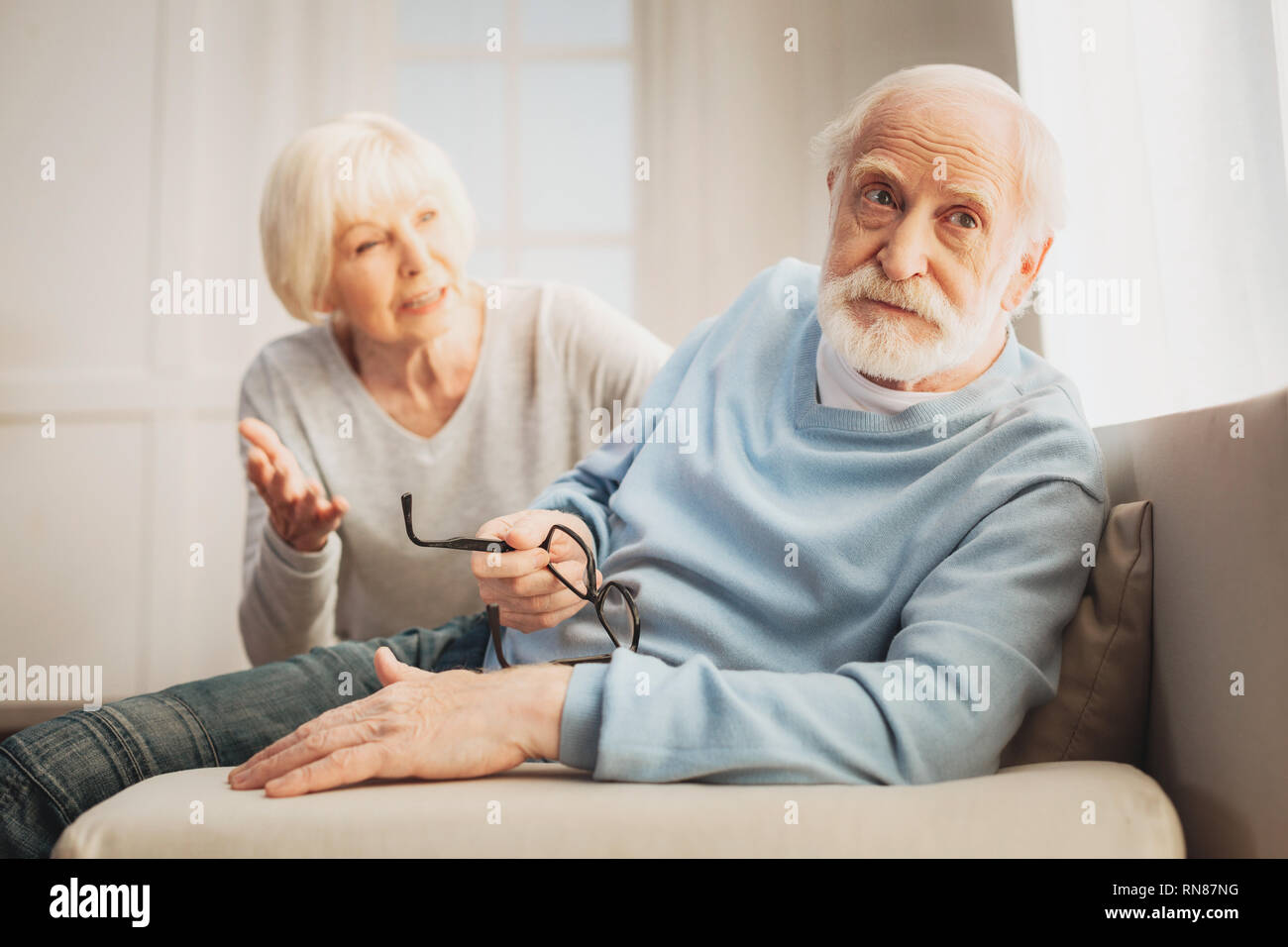 Personal problems. Aged sad man feeling sensitive while discussing ...