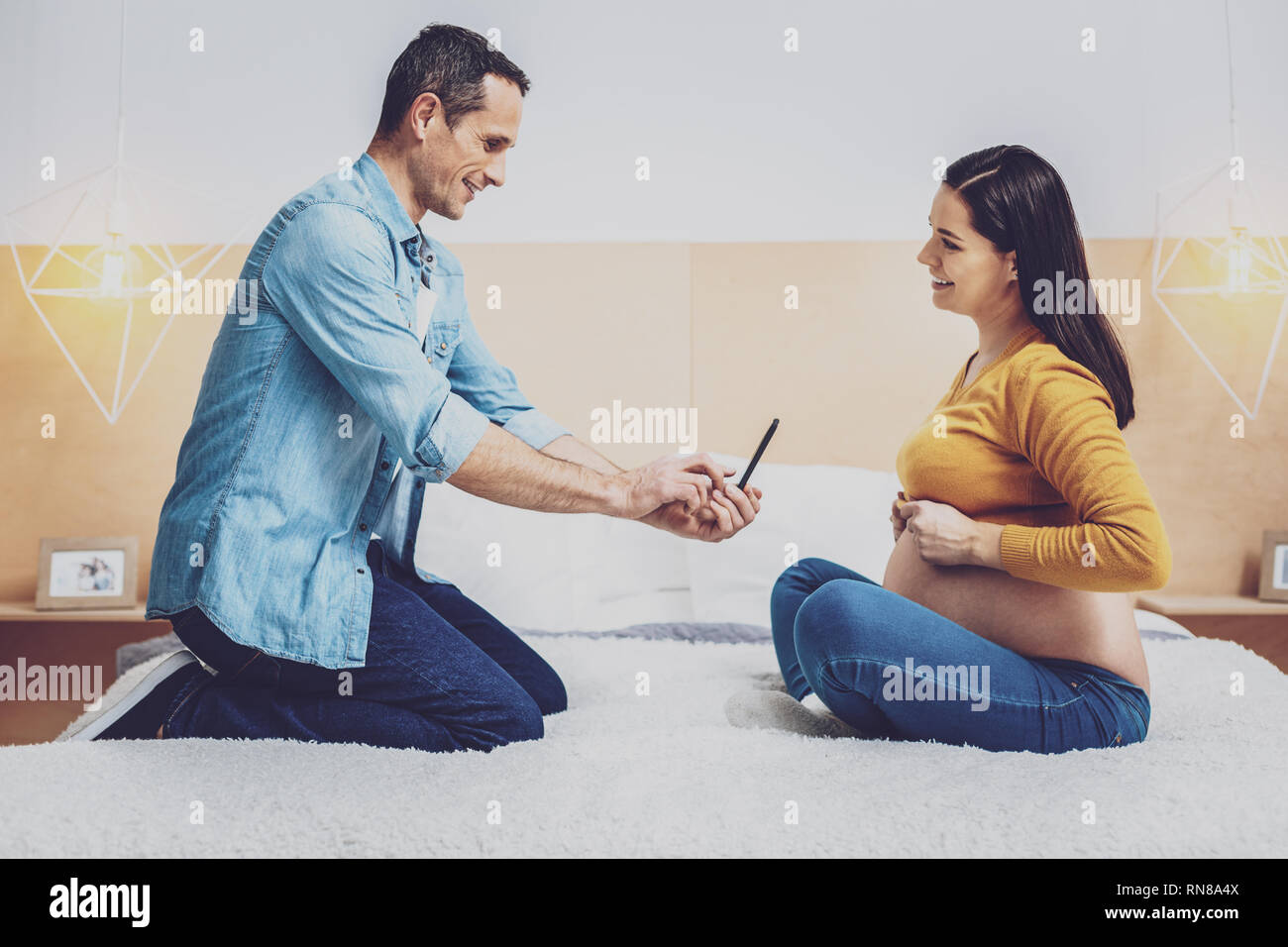 Do not move. Profile photo of handsome man that using his telephone ...