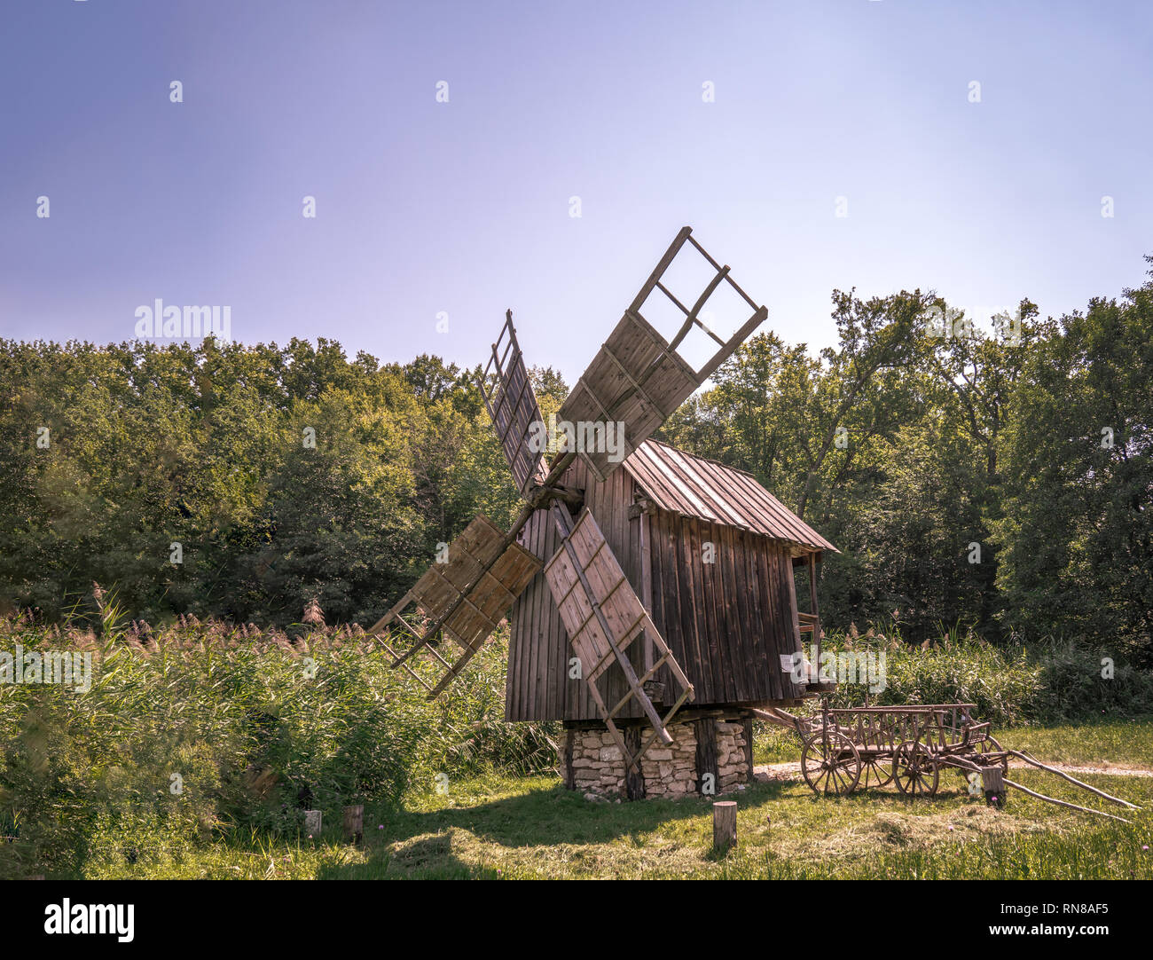 Traditional windmill in folk museum park on a sunny day in natural ...